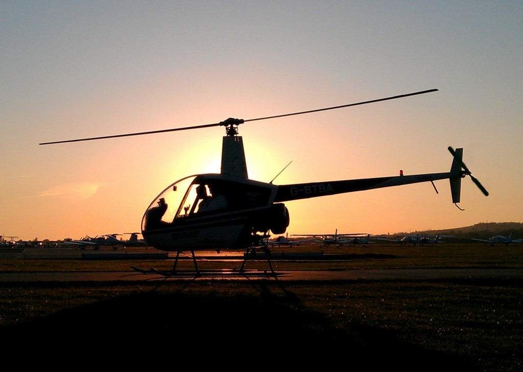 R22 helicopter at sunset | Advance Helicopters